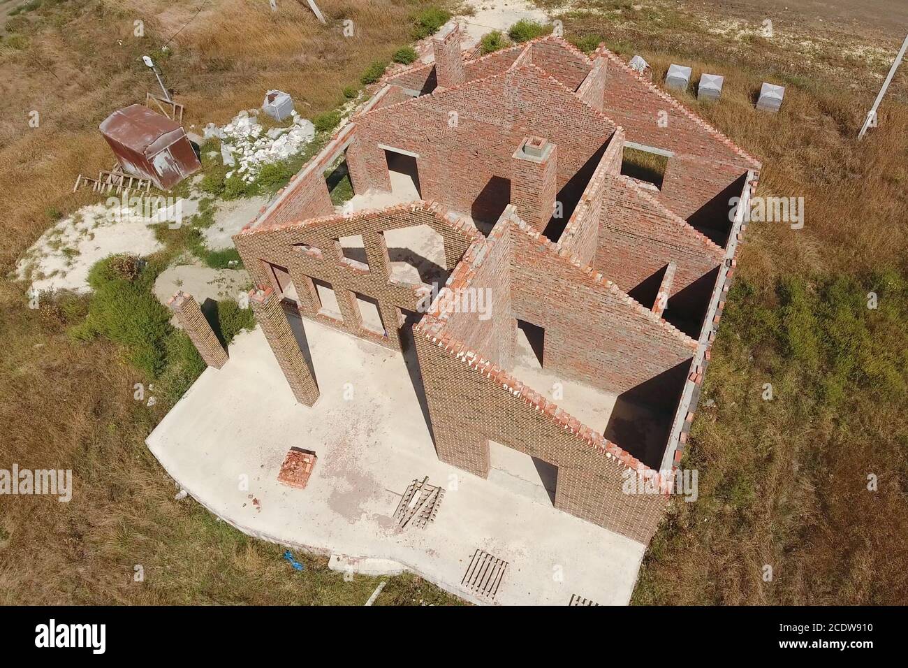 The house is built of red brick. The walls of the house are a top view ...
