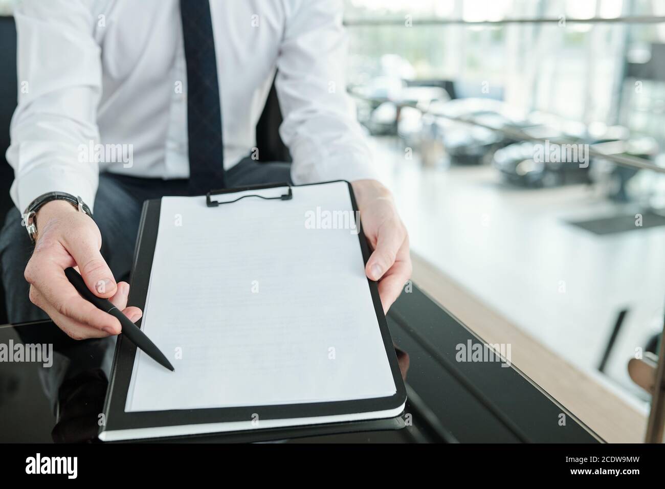 Young agent pointing place hi-res stock photography and images - Alamy