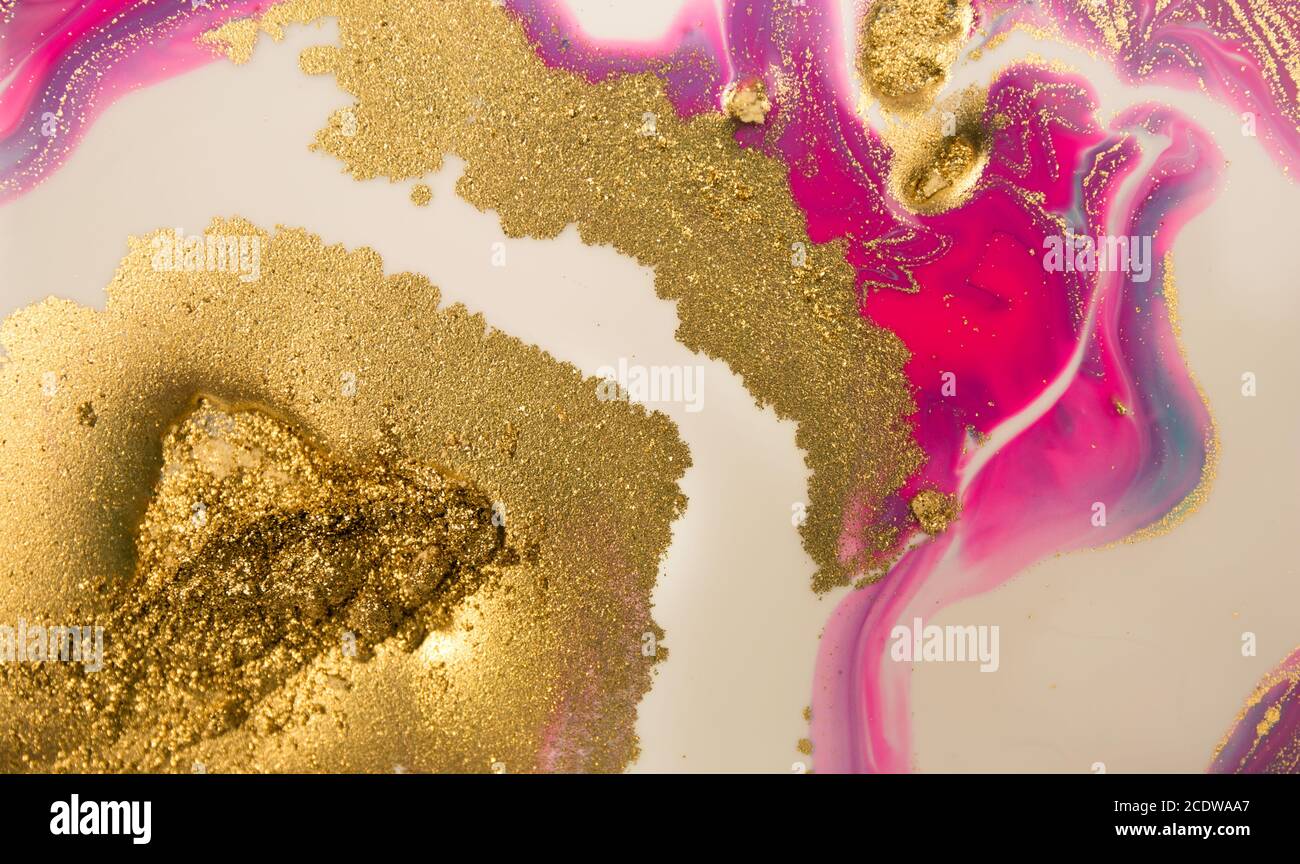 Piles of gold sequins on pink smudges of paint. Abstract pattern Stock ...