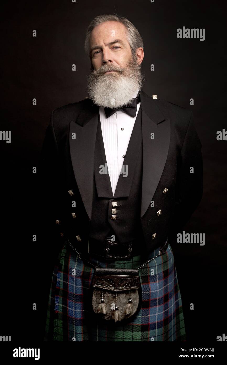 mature male model wearing kilt with grey hairstyle and beard Stock ...