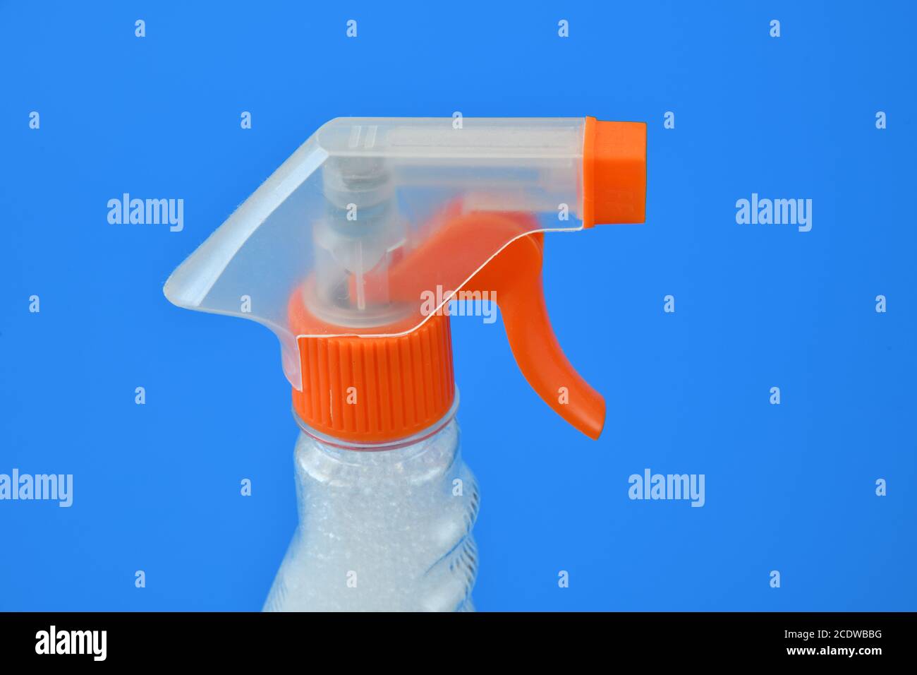 spray bottle with cleaning agents on blue background Stock Photo - Alamy