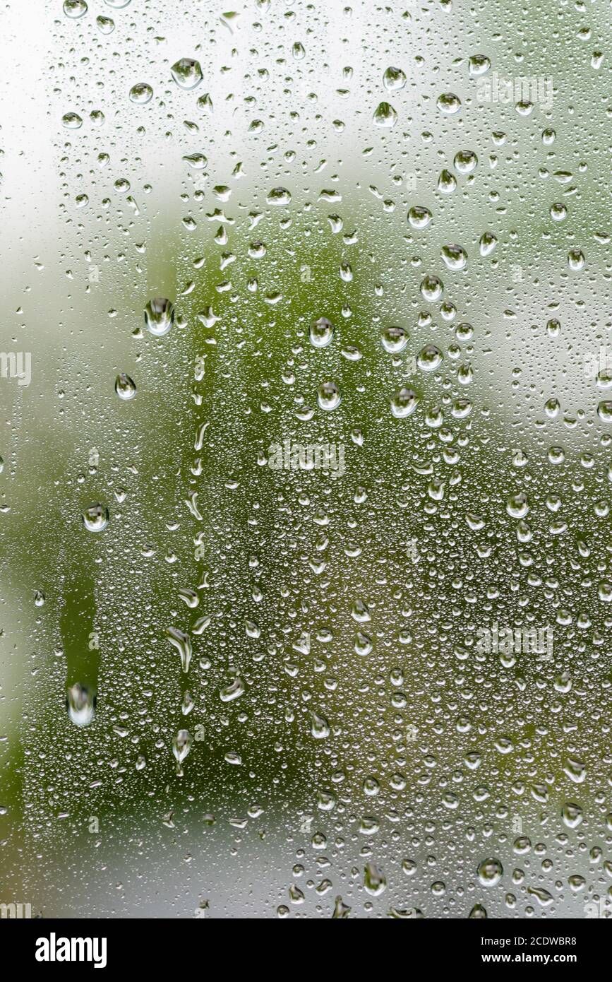 Water drops from rain on window glass Stock Photo - Alamy