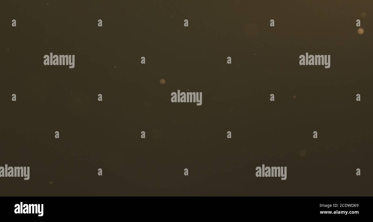 dust particles floating in air with warm light, wide photo Stock Photo ...