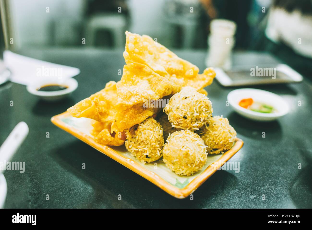 fried wanton and fish ball snack Stock Photo - Alamy