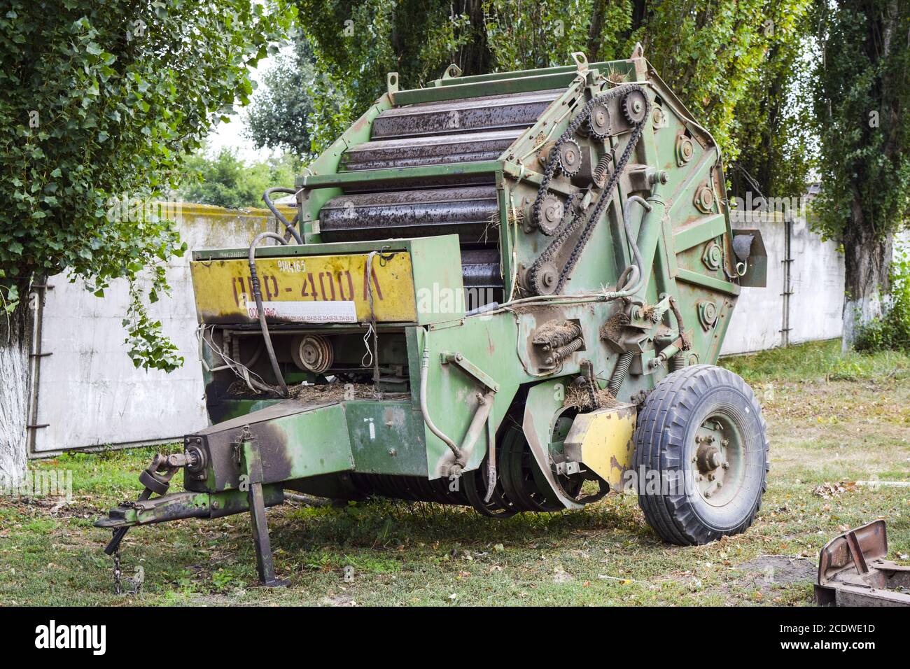 Trailer with a mechanism for creating bales of hay Stock Photo - Alamy