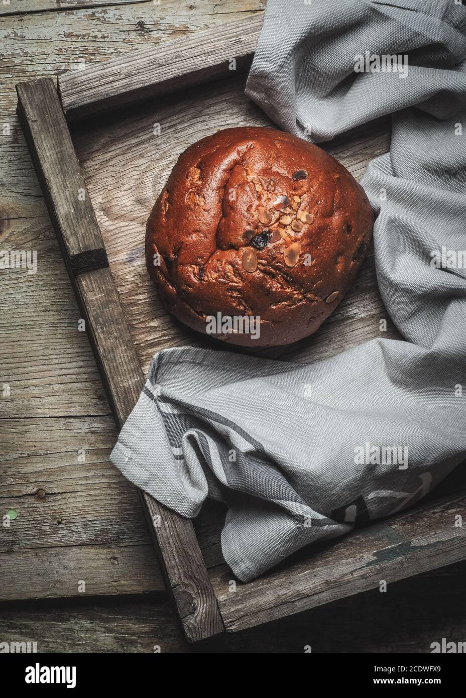 Sweet bread, typical Slovak round cake on vintage wooden background ...