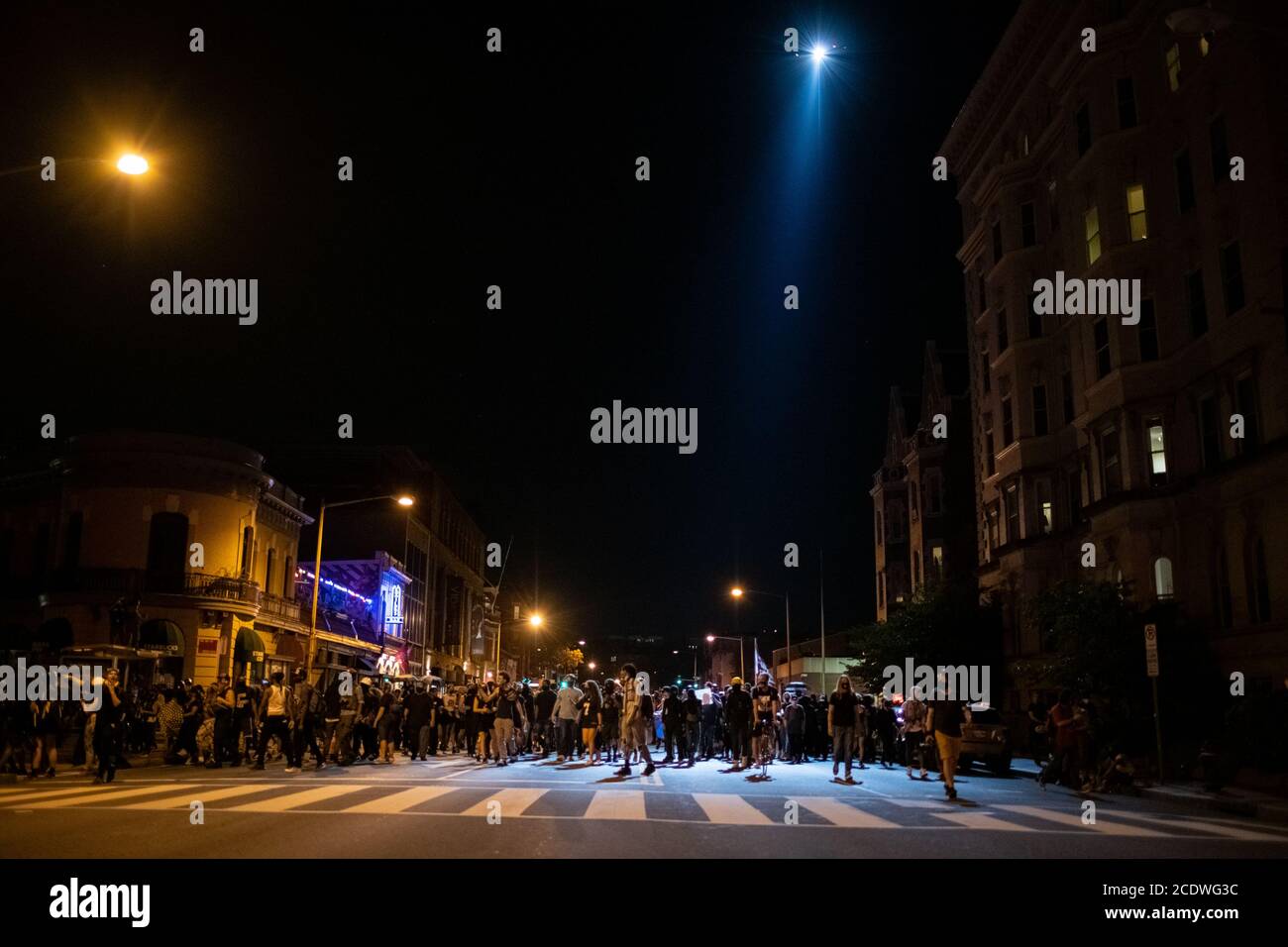 Police helicopter spotlight hi-res stock photography and images - Alamy