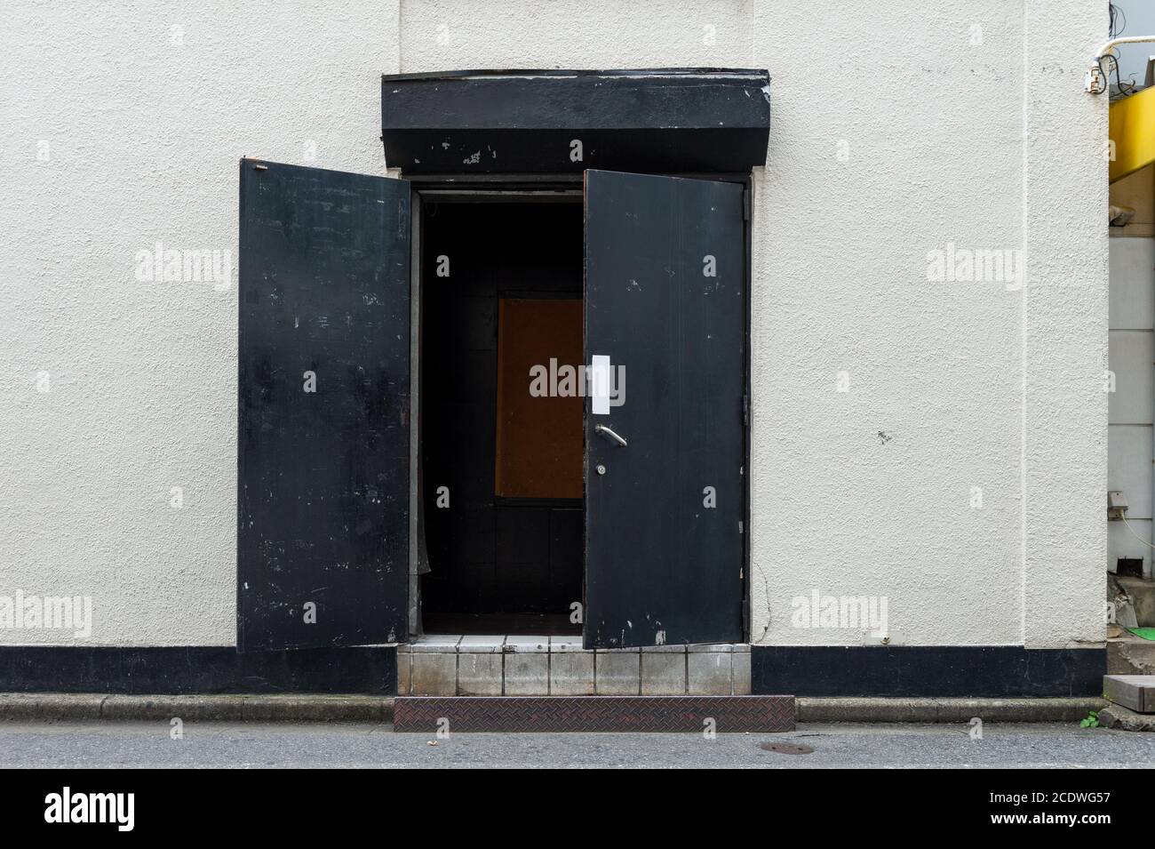 sidewalk by street wall & door Stock Photo - Alamy