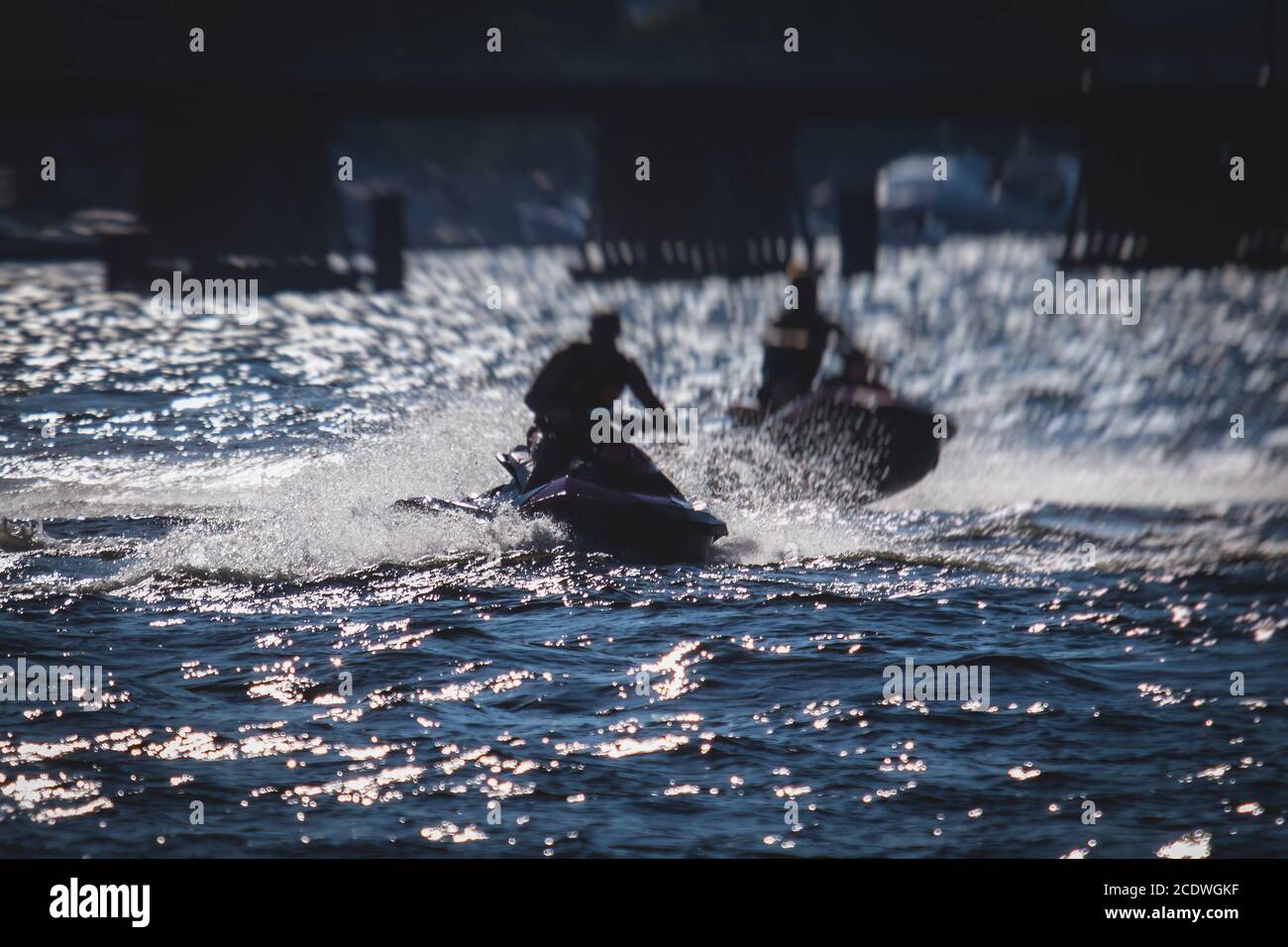 View of jet ski in motion, group of jet skiers with a big water splash ...