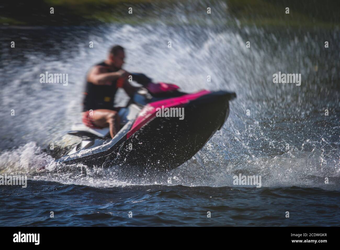 View of jet ski in motion, group of jet skiers with a big water splash ...