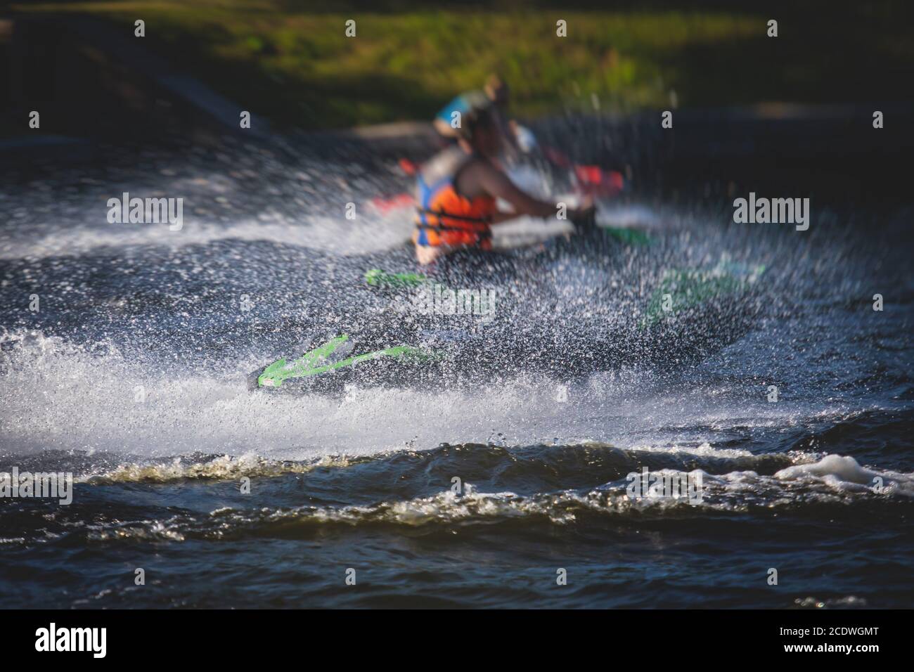 View of jet ski in motion, group of jet skiers with a big water splash ...