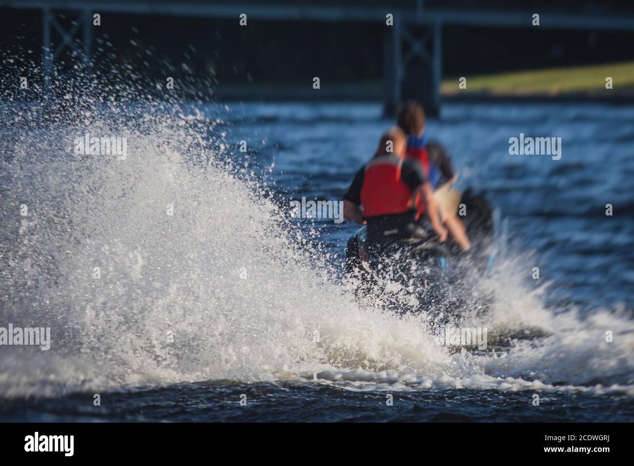 View of jet ski in motion, group of jet skiers with a big water splash ...
