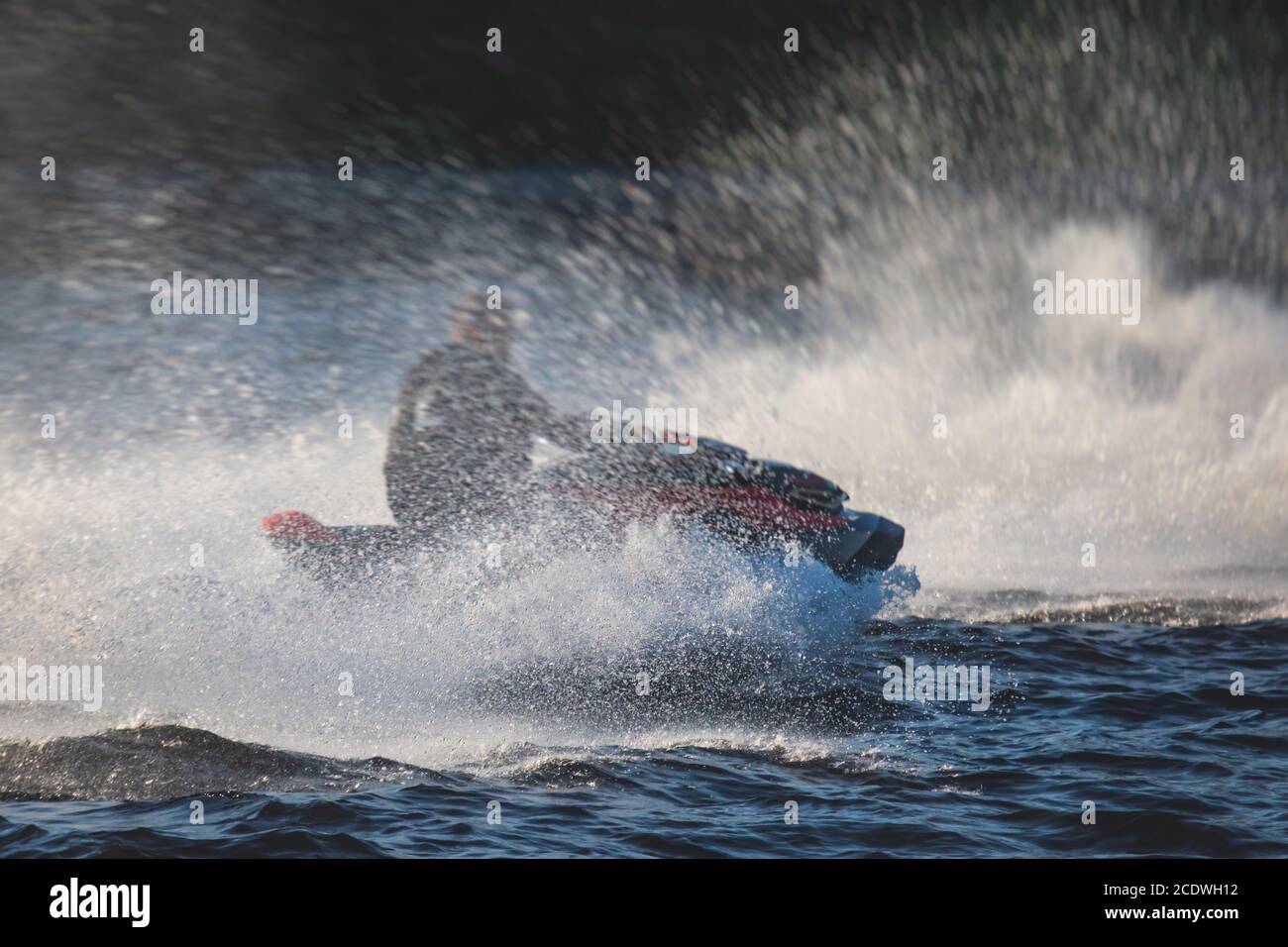 View of jet ski in motion, group of jet skiers with a big water splash ...