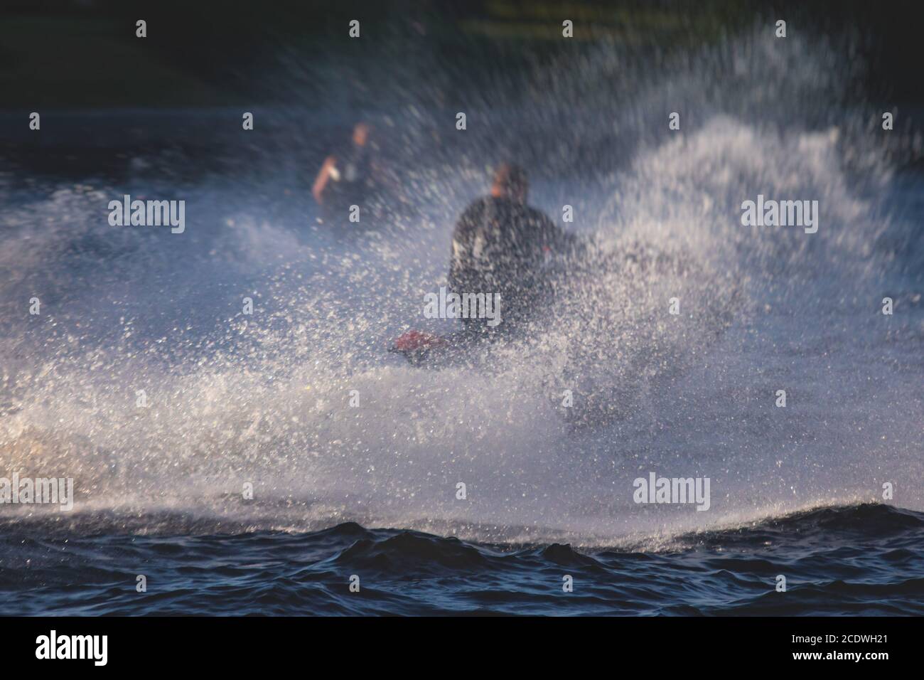 View of jet ski in motion, group of jet skiers with a big water splash ...