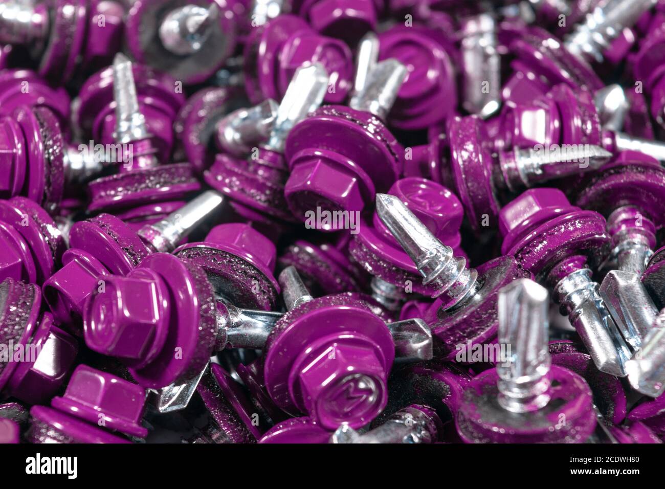 Top view of roofing screws background texture. Red roofing screws ...