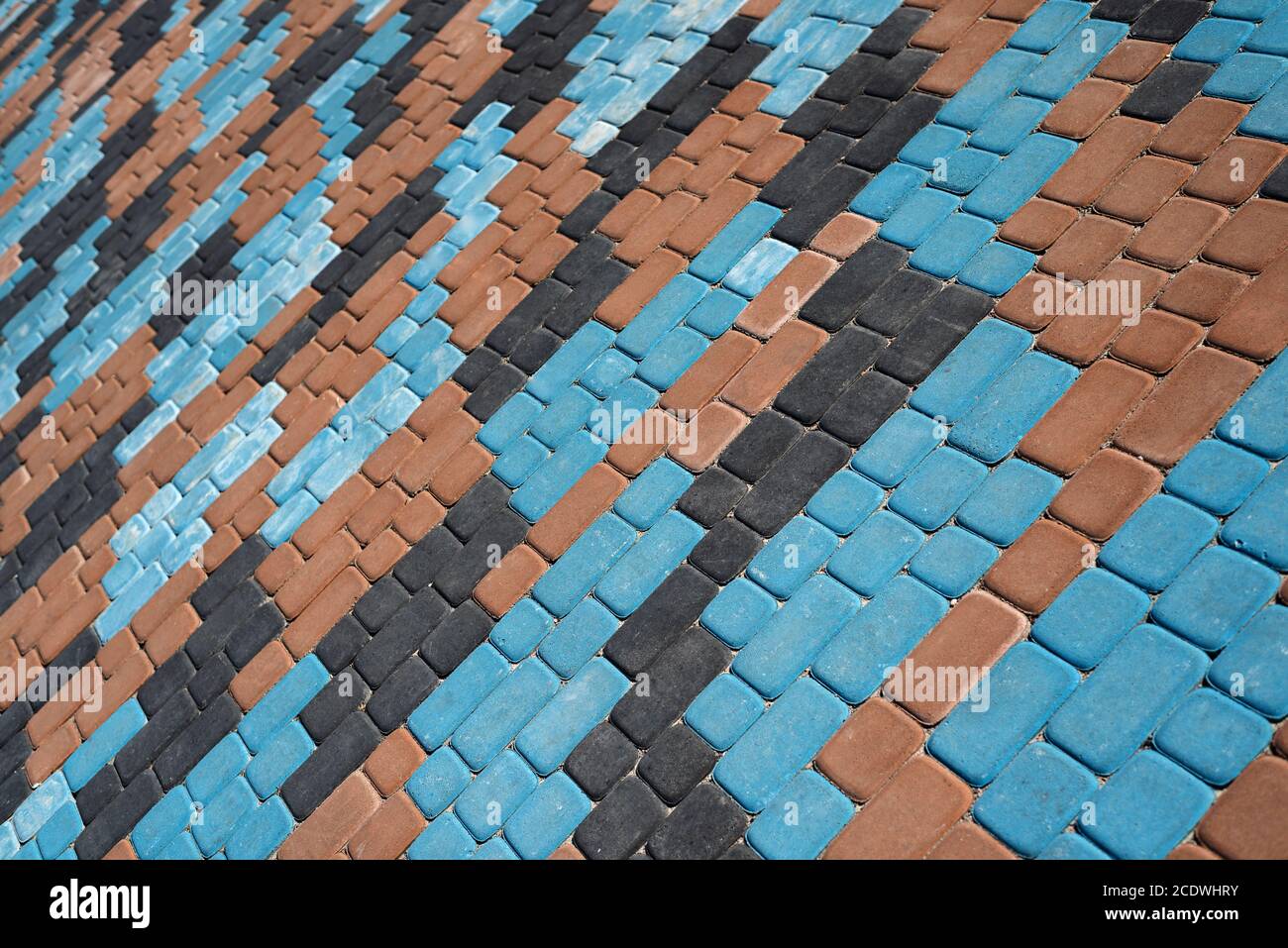 Multi-colored paving slabs in perspective. Abstract textured background ...