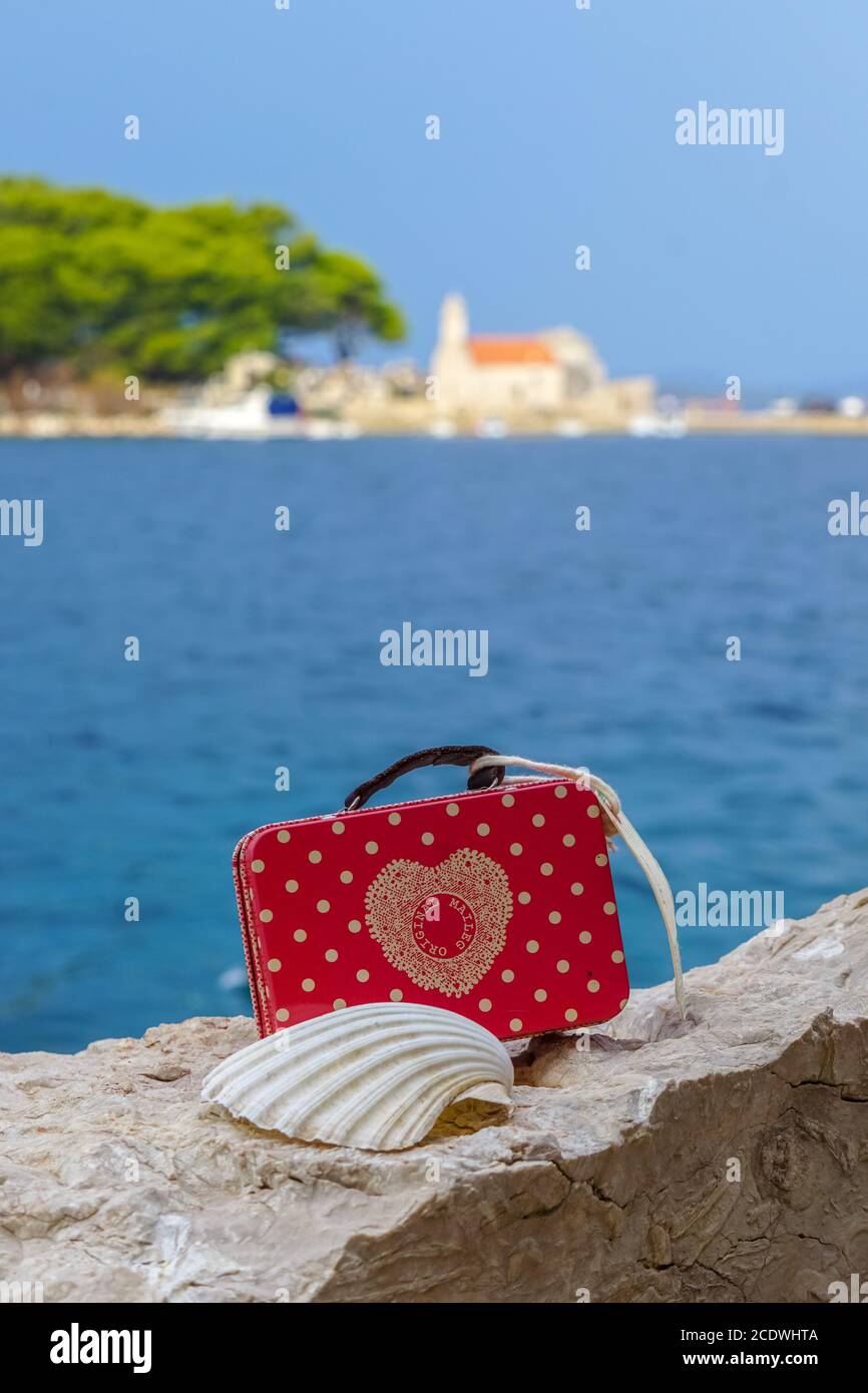 Little red suitcase on travel Stock Photo - Alamy