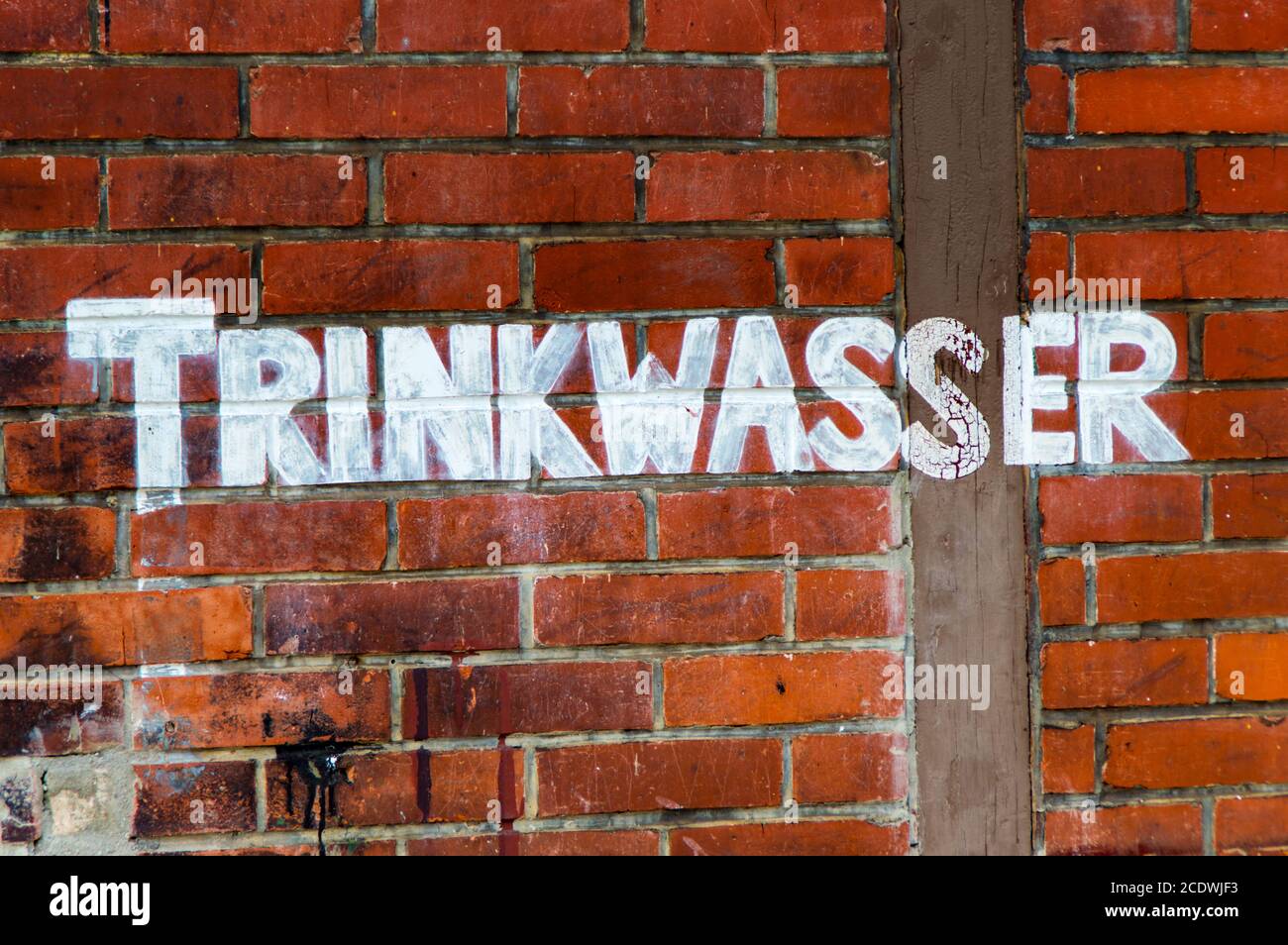 Lettering drinking water painted on a stone wall Stock Photo - Alamy
