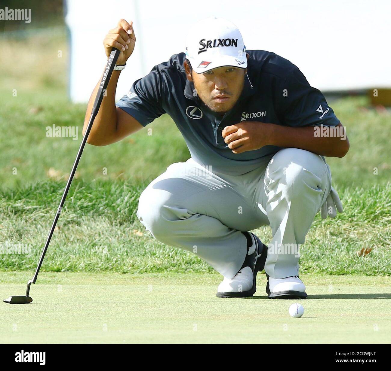 Japanese golfer Hideki Matsuyama lines up a putt on the 15th green ...