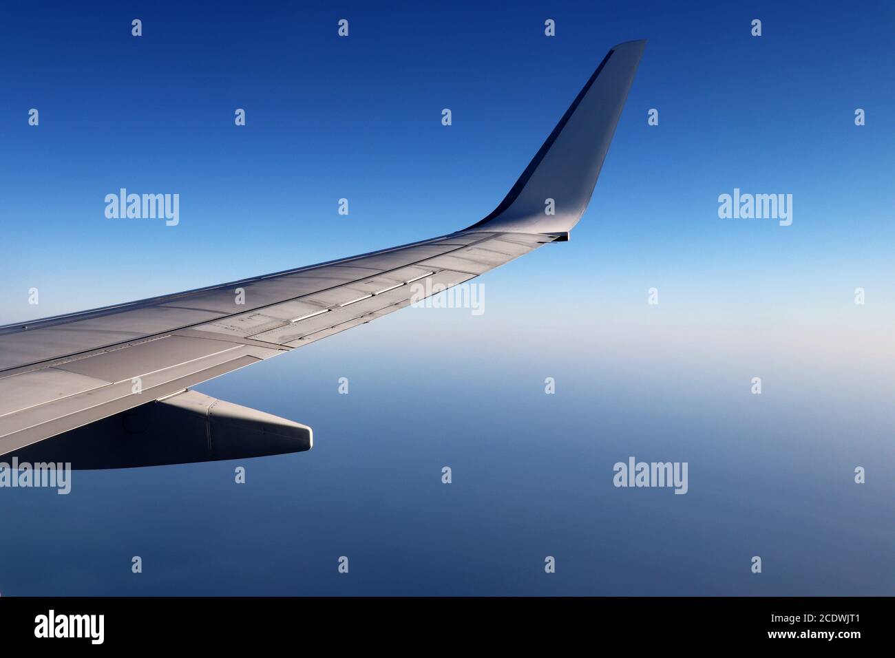 Airplane wing view Stock Photo - Alamy