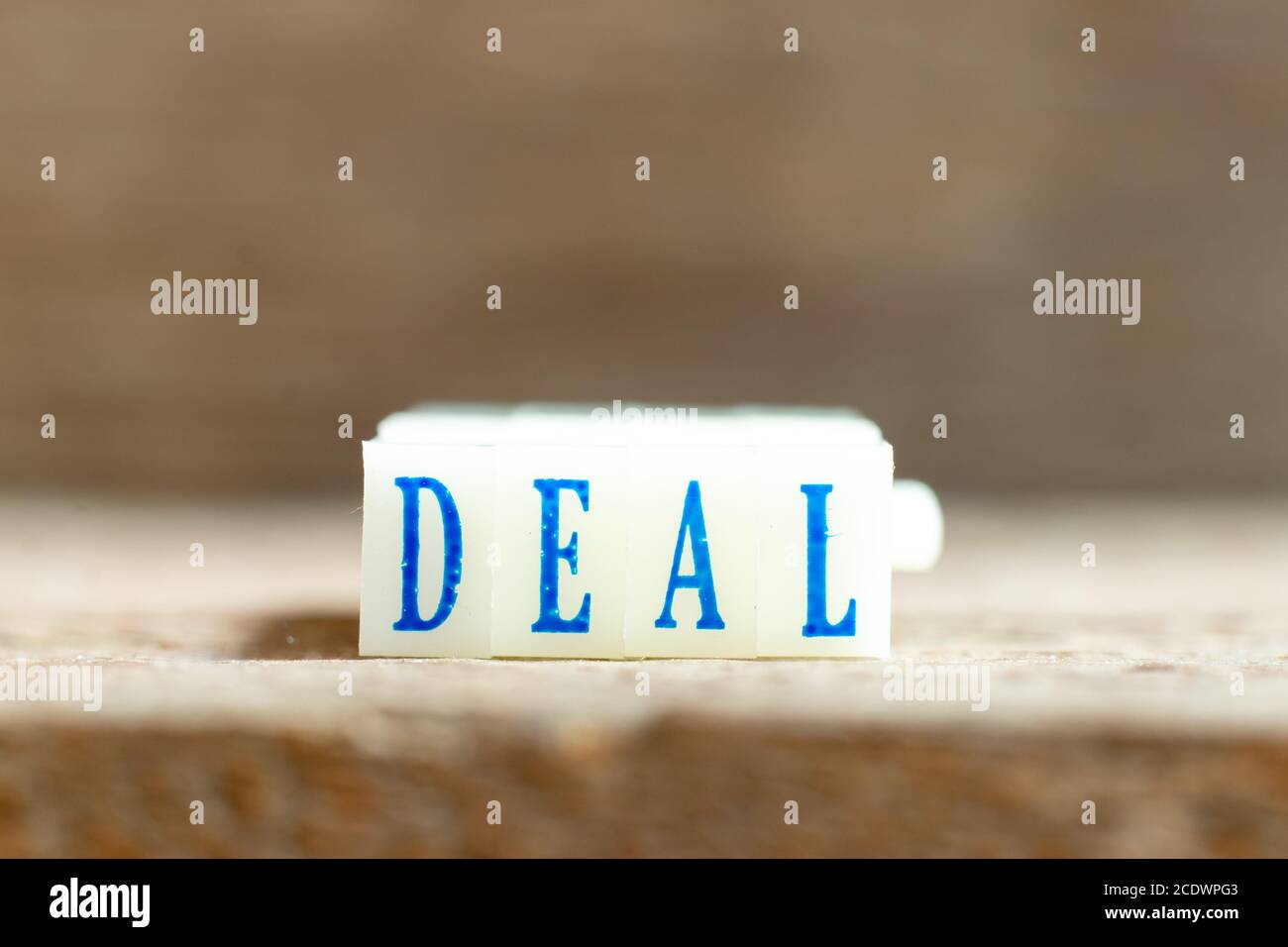 Letter block with blue color word deal on wood background Stock Photo ...