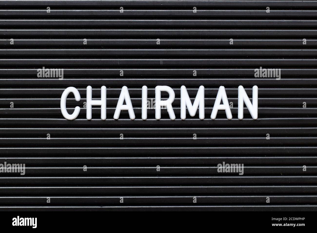 Black felt board with white alphabet in word chairman background Stock ...