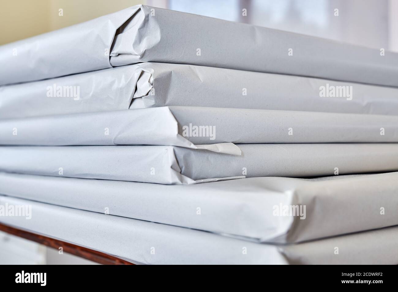 Objects wrapped in tissue paper Stock Photo - Alamy