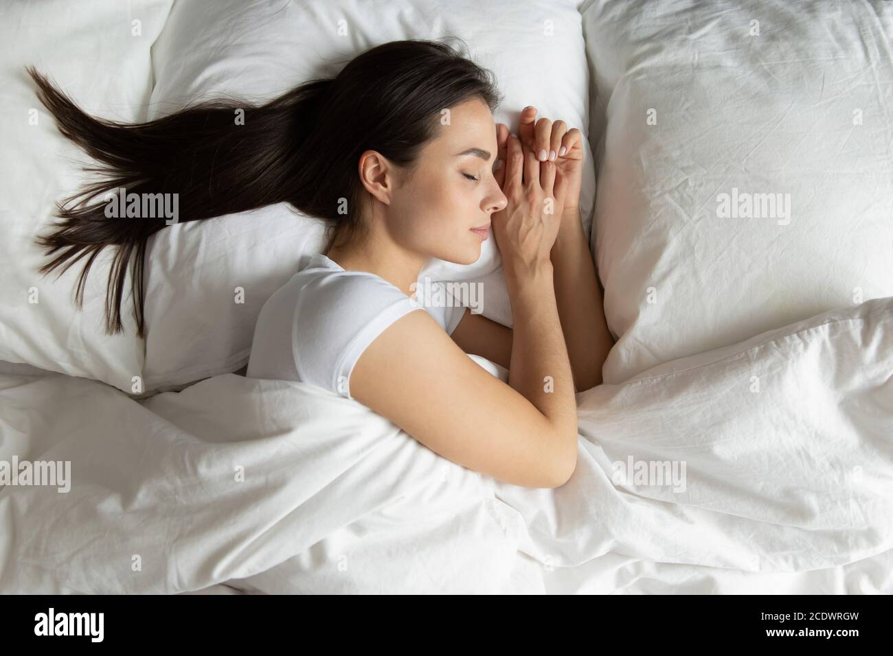 Top view beautiful young woman sleeping in cozy bed Stock Photo - Alamy