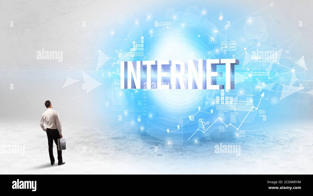 Rear view of a businessman standing in front of INTERNET inscription ...