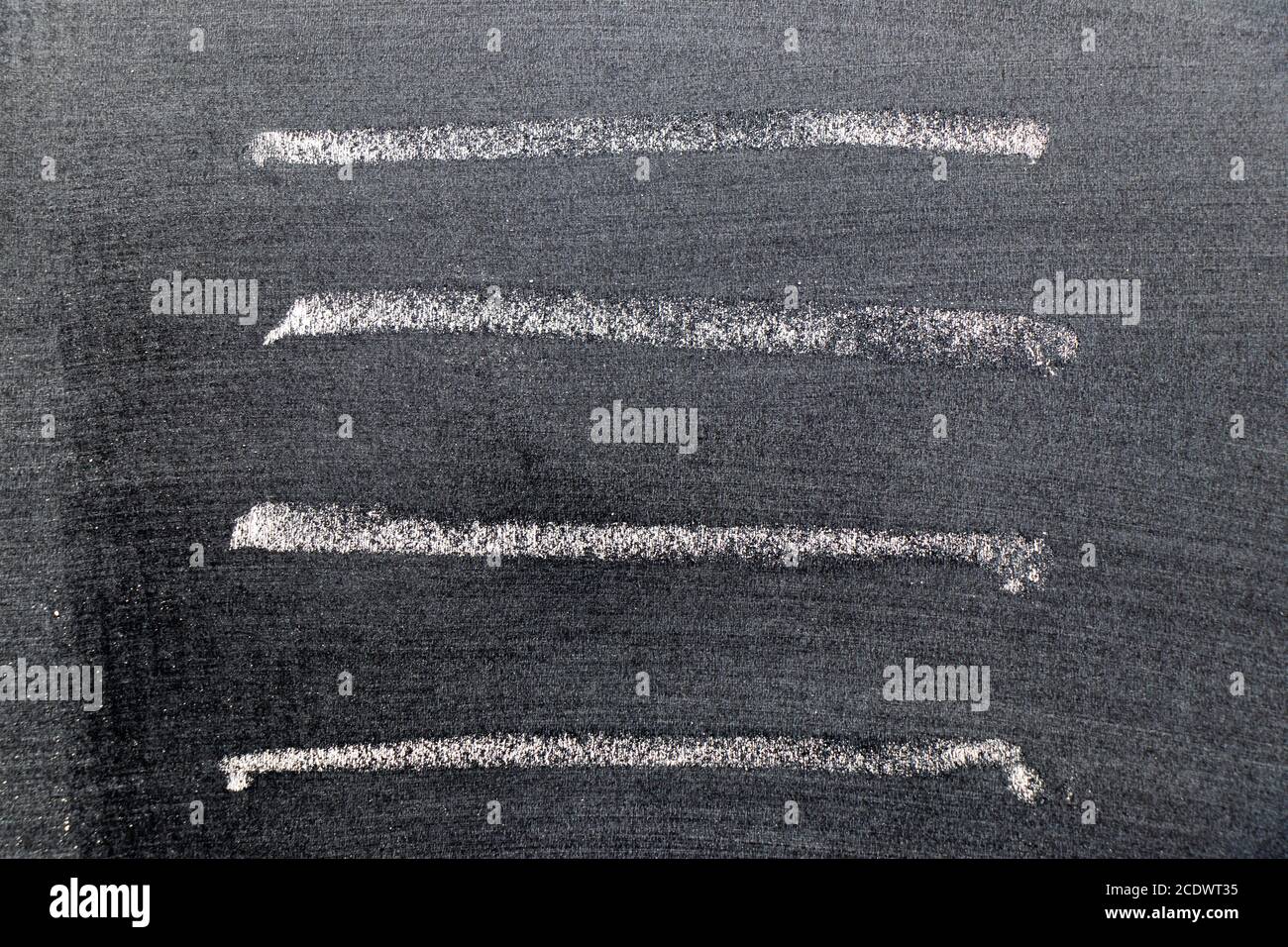 White color chalk hand drawing in set of line shape on black board ...