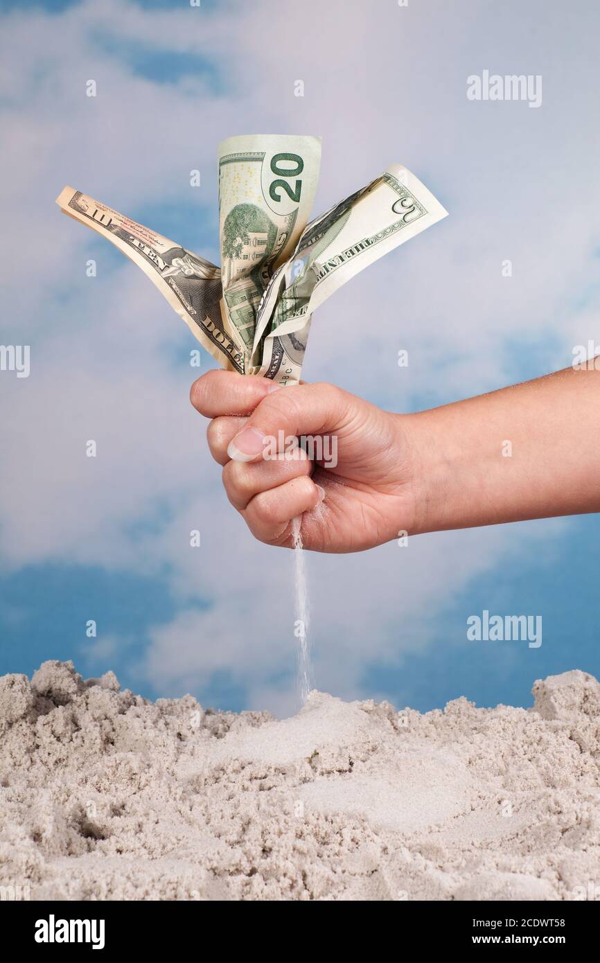 Female hand dropping coin hi-res stock photography and images - Alamy