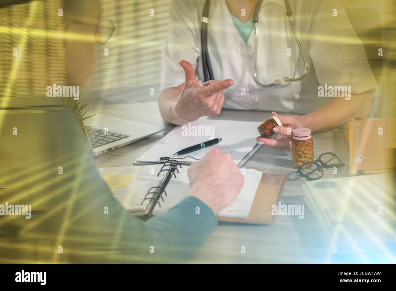 Female doctor explaining medicine to her patient in medical office ...