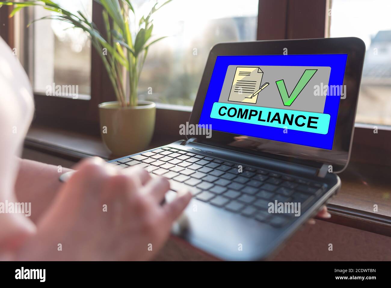 Laptop screen displaying a compliance concept Stock Photo - Alamy