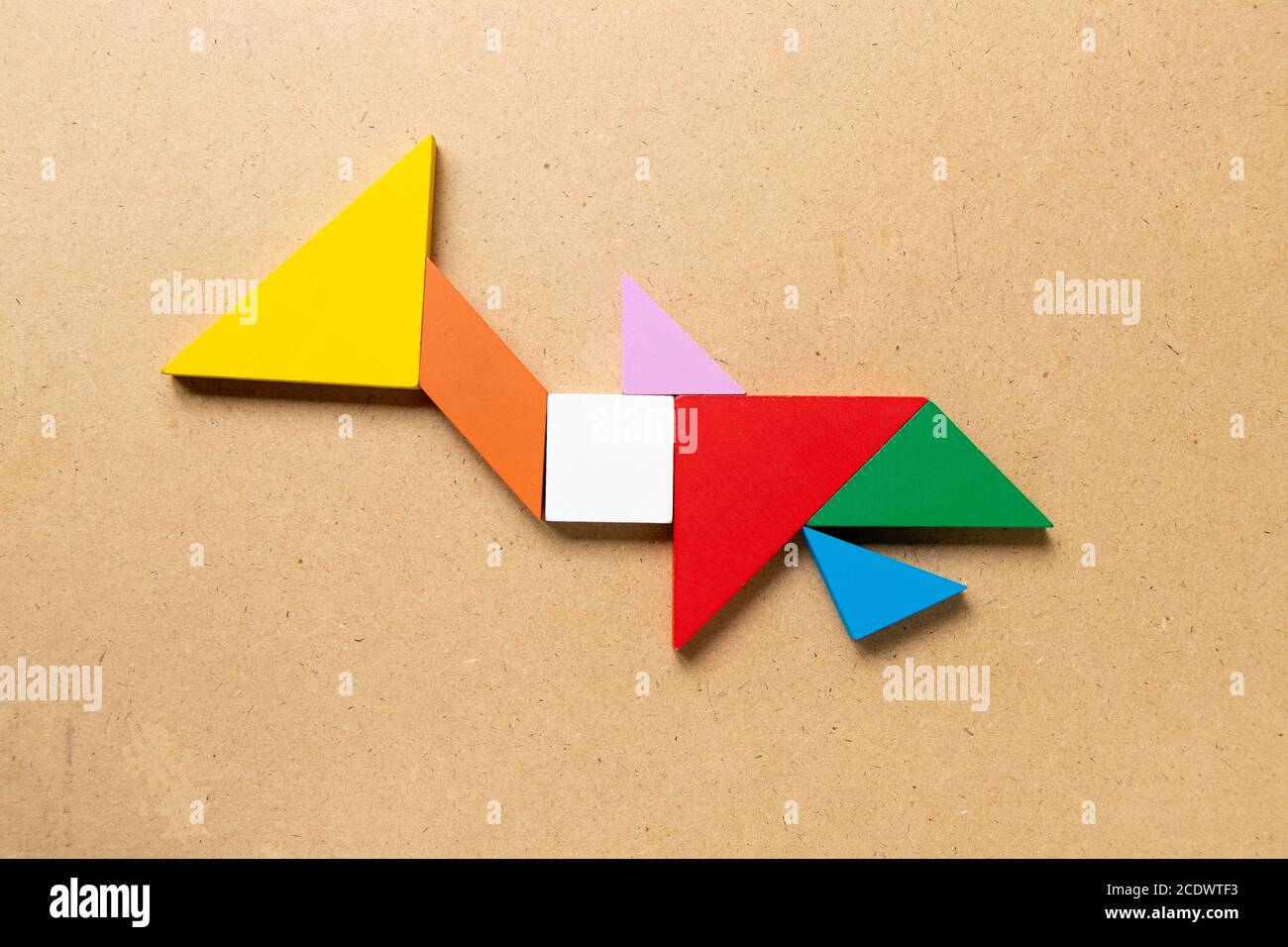 Color tangram puzzle in shark or whale shape on wood background Stock ...