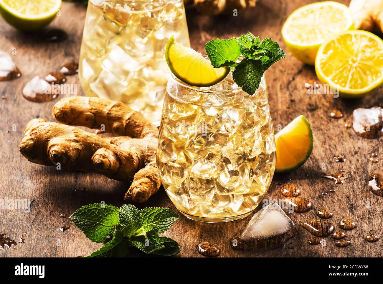 Golden Ginger Ale Beer Cocktail with Lime, Lemon and Mint in glaass on ...