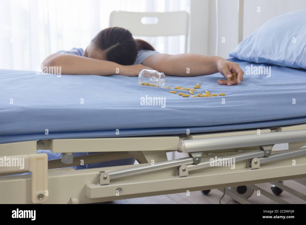 Female patients in the hospital overdose unconscious beside the bed ...