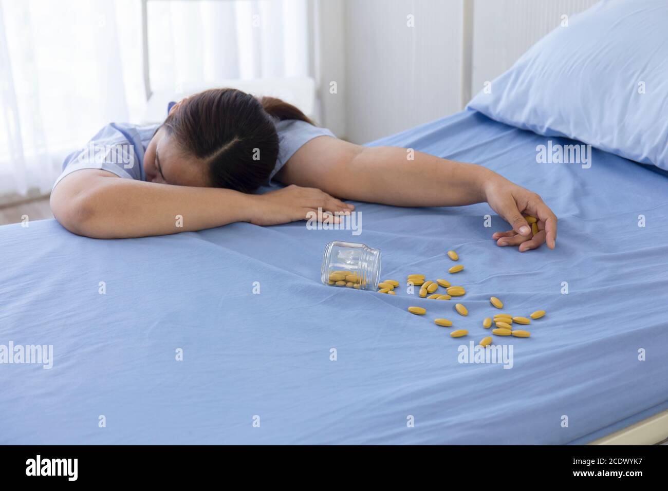Female patients in the hospital overdose unconscious beside the bed ...