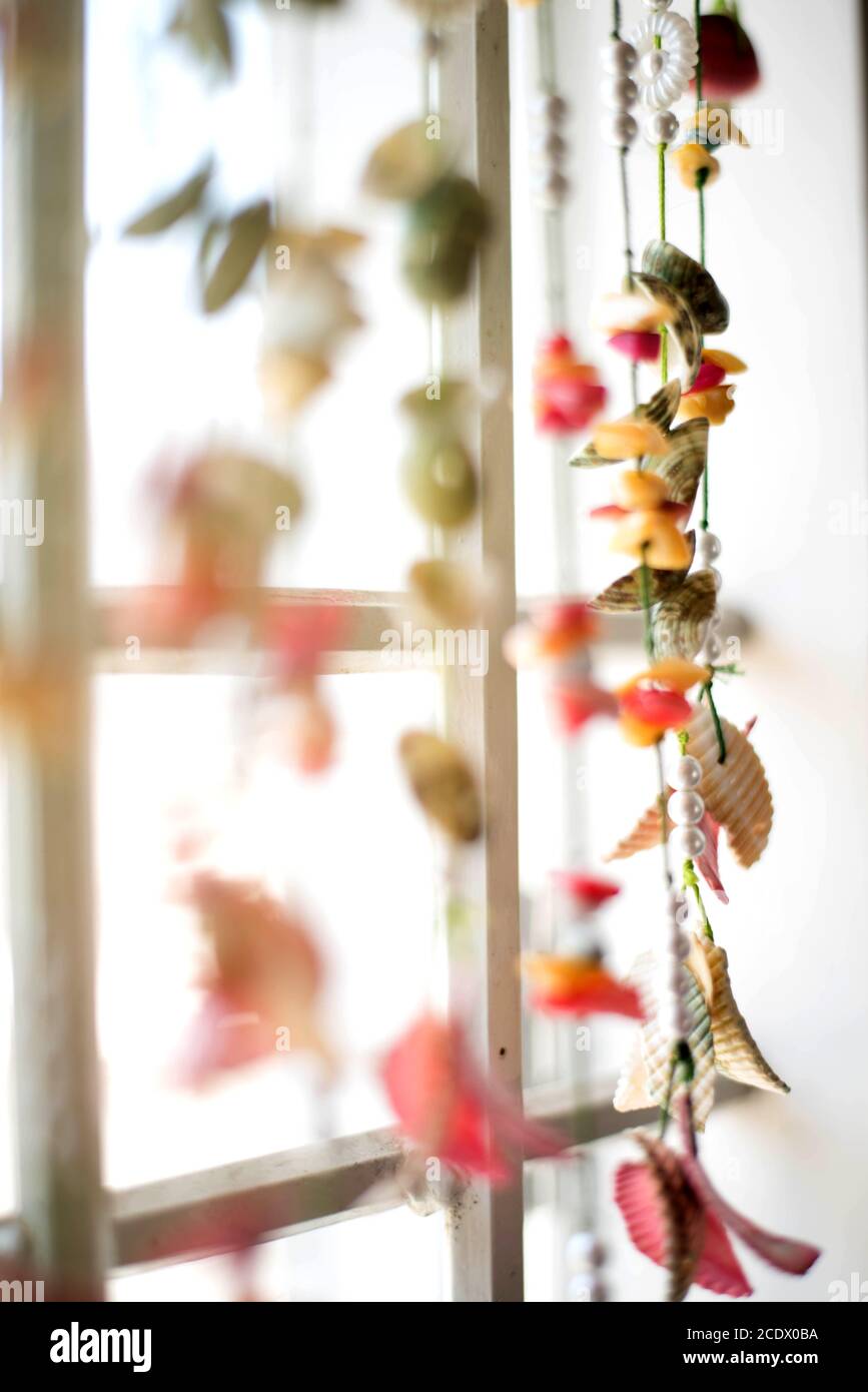 hanging threads for window decor Stock Photo - Alamy