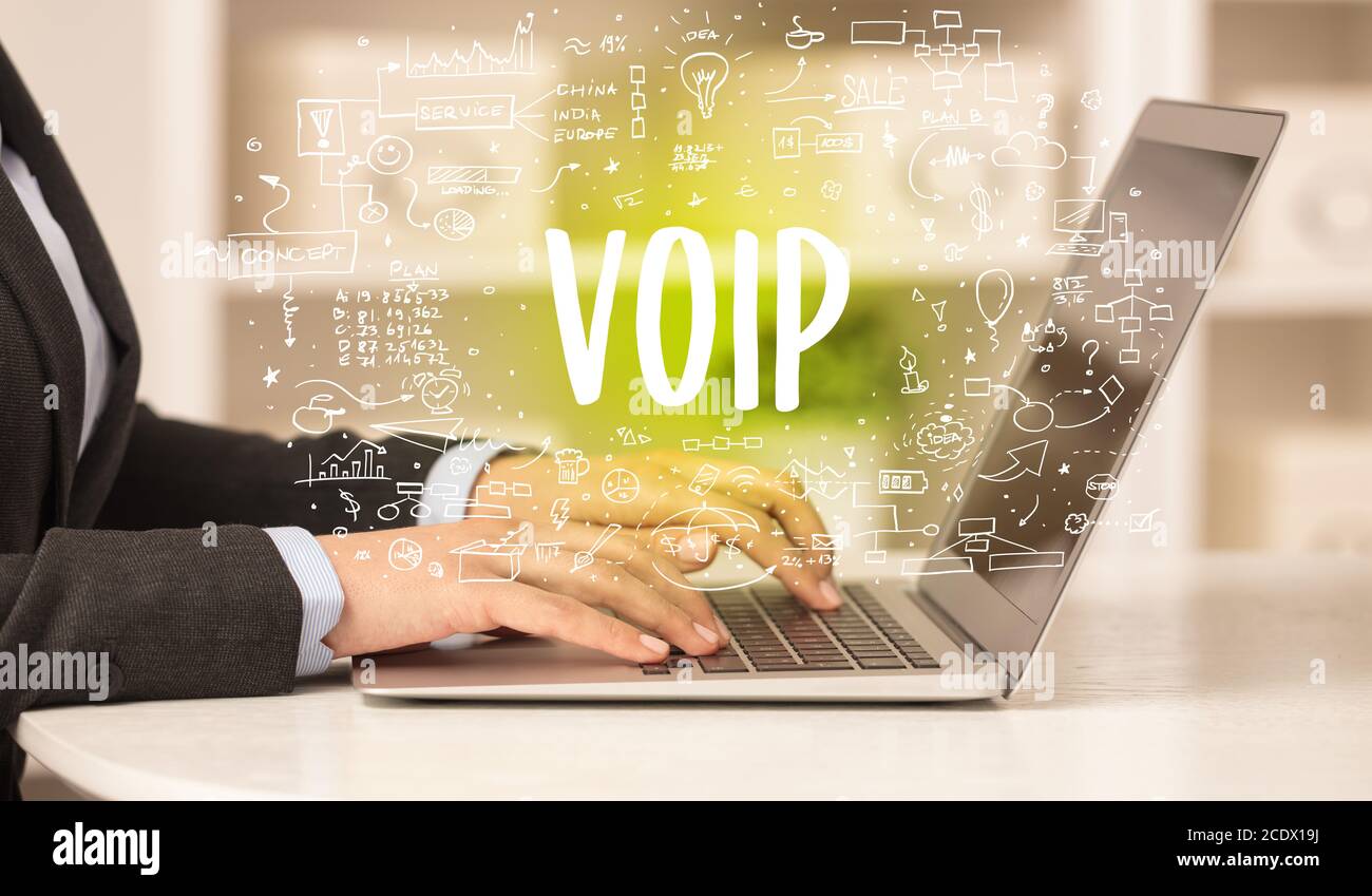 hand working on new modern computer with VOIP abbreviation, modern ...
