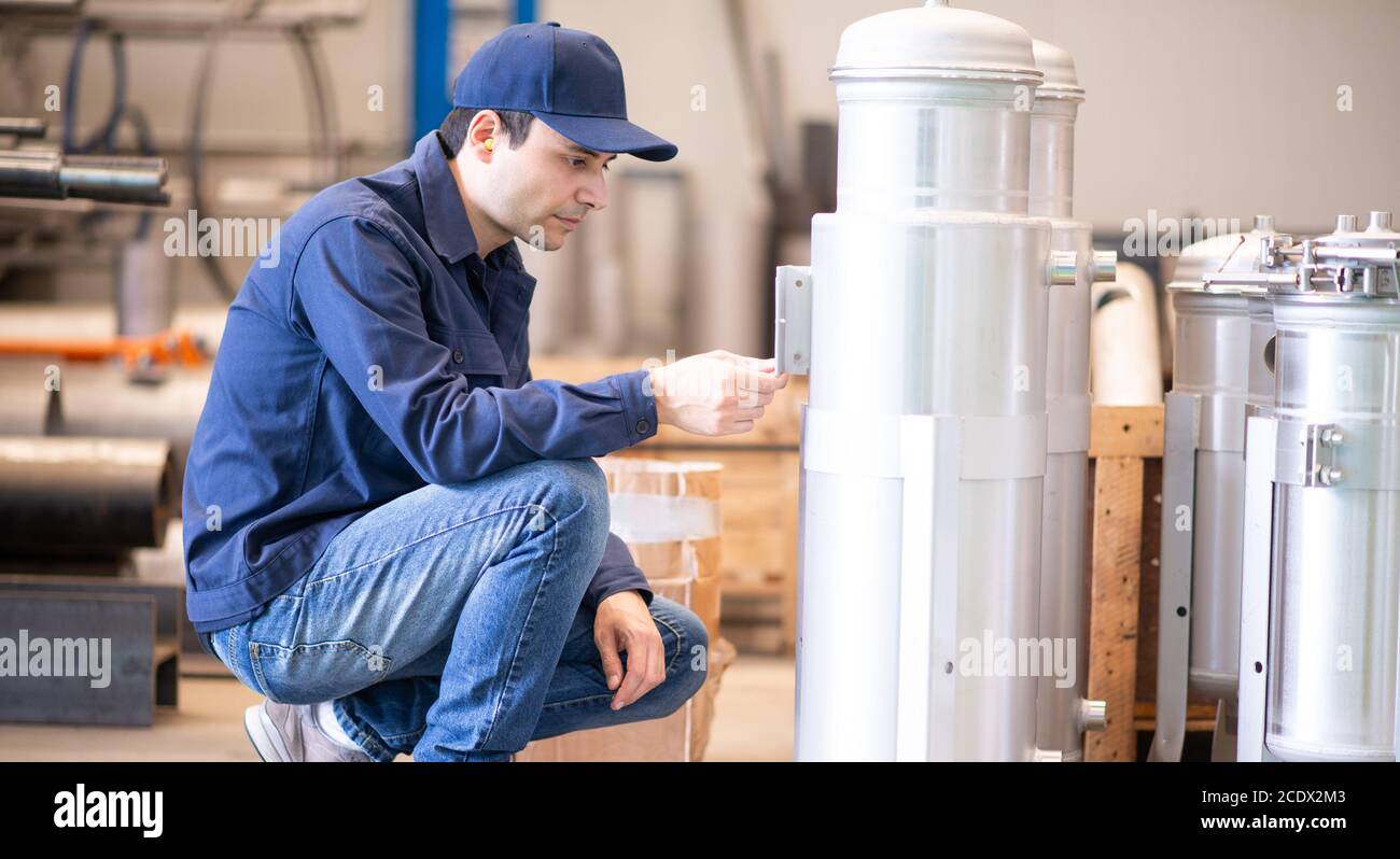 Engineer supervisor checking a vessel in a factory Stock Photo - Alamy