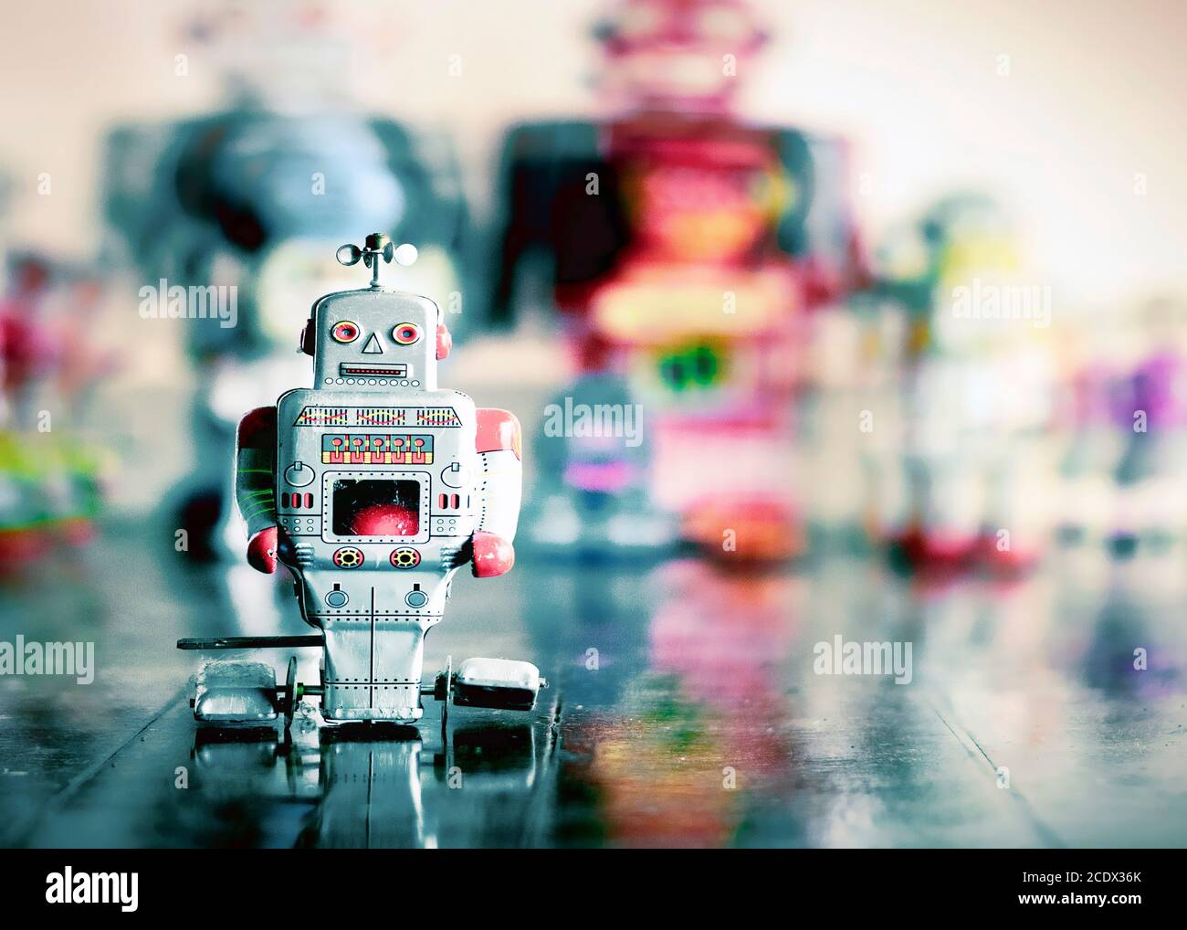 little silver robot on wooden floor blured background copy space Stock ...
