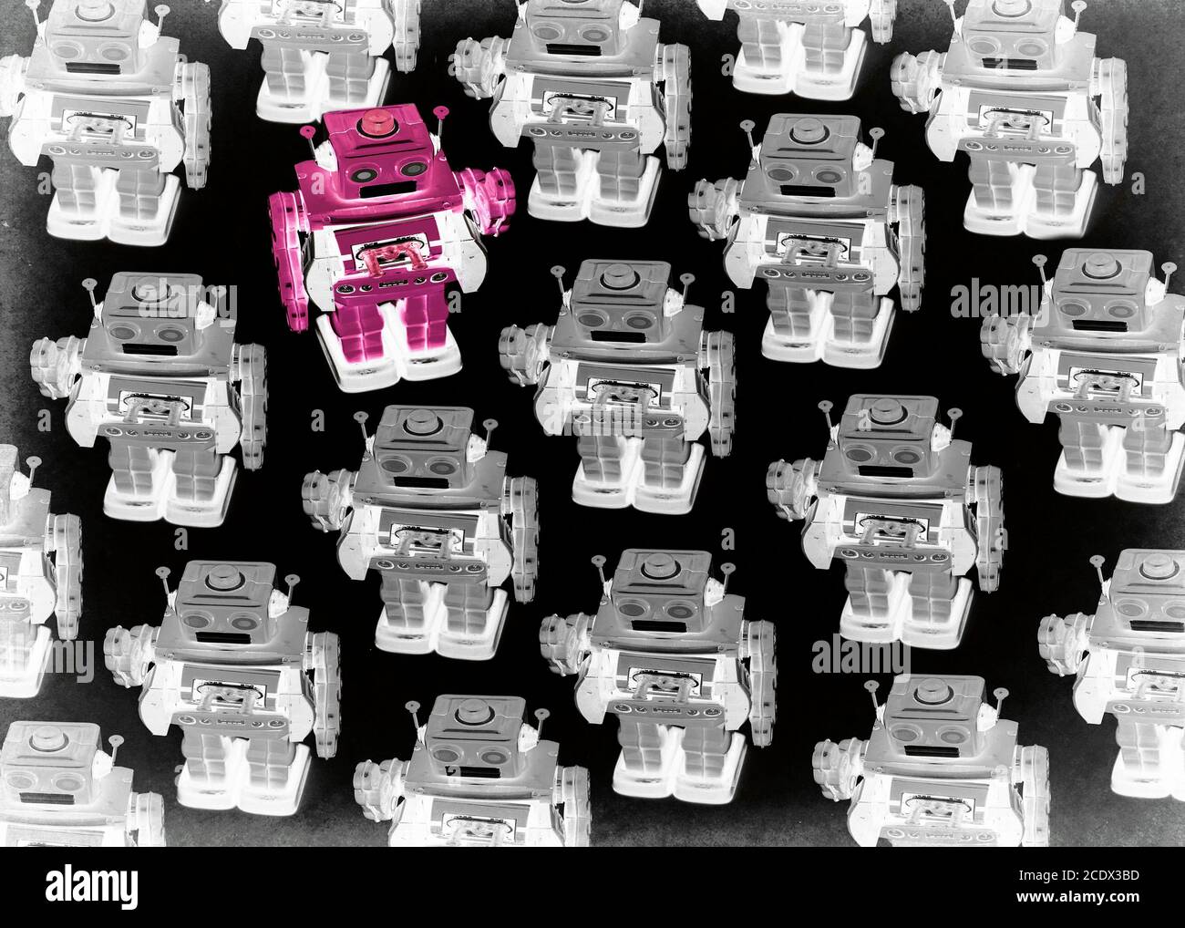 concept gong against the crowed with retro robot toys Stock Photo - Alamy