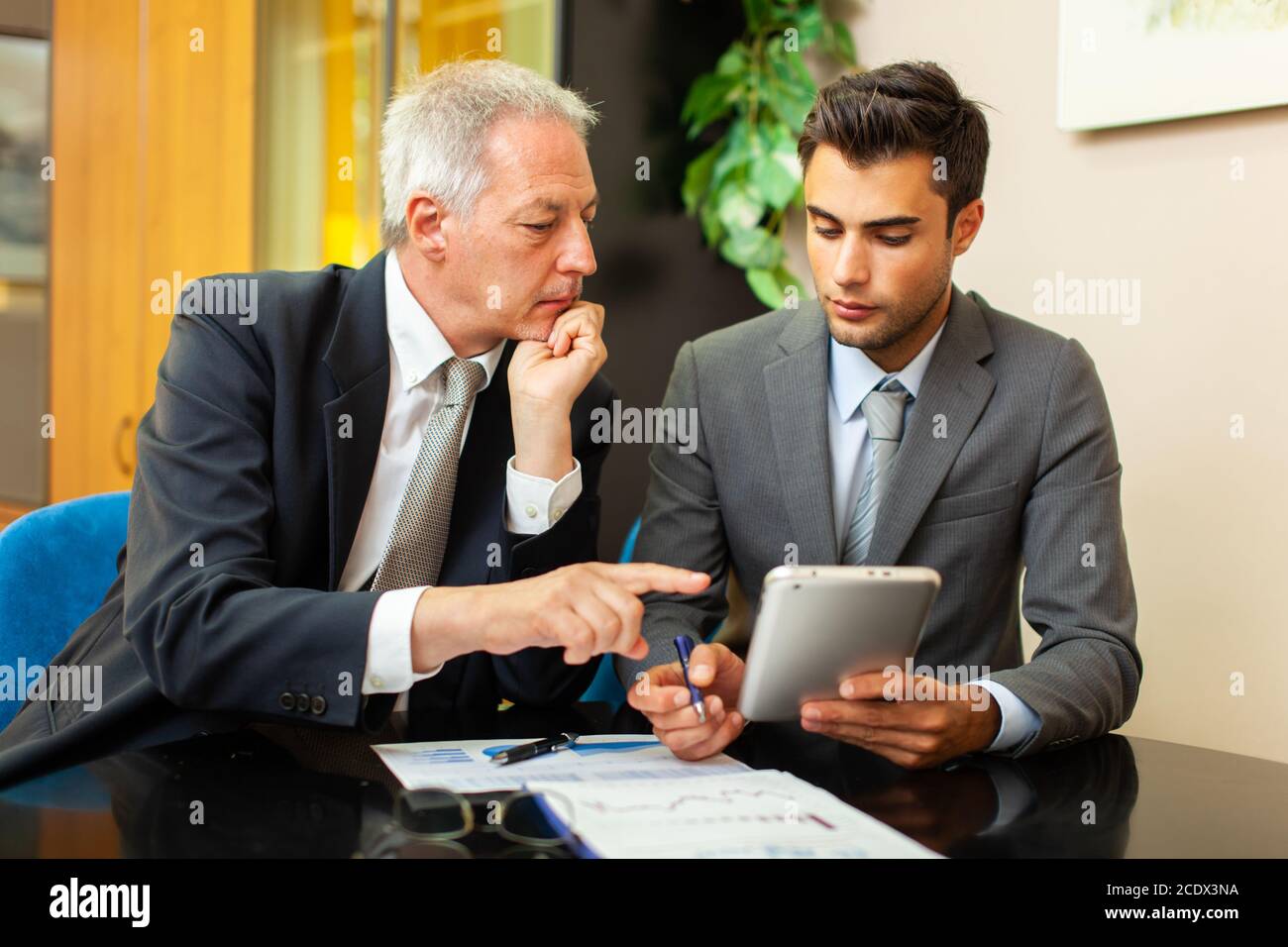 Discussing financial charts hi-res stock photography and images - Alamy