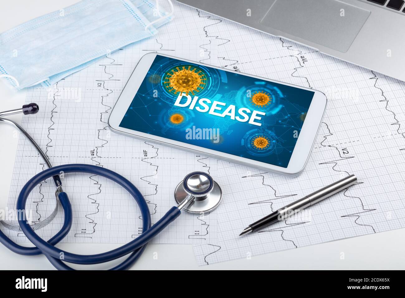 Close-up view of a tablet pc with DISEASE inscription, microbiology ...