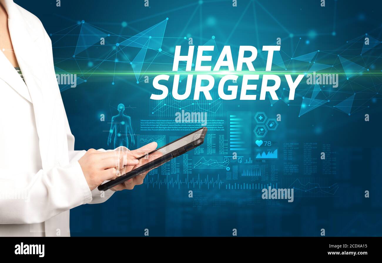 doctor writes notes on the clipboard with HEART SURGERY inscription ...