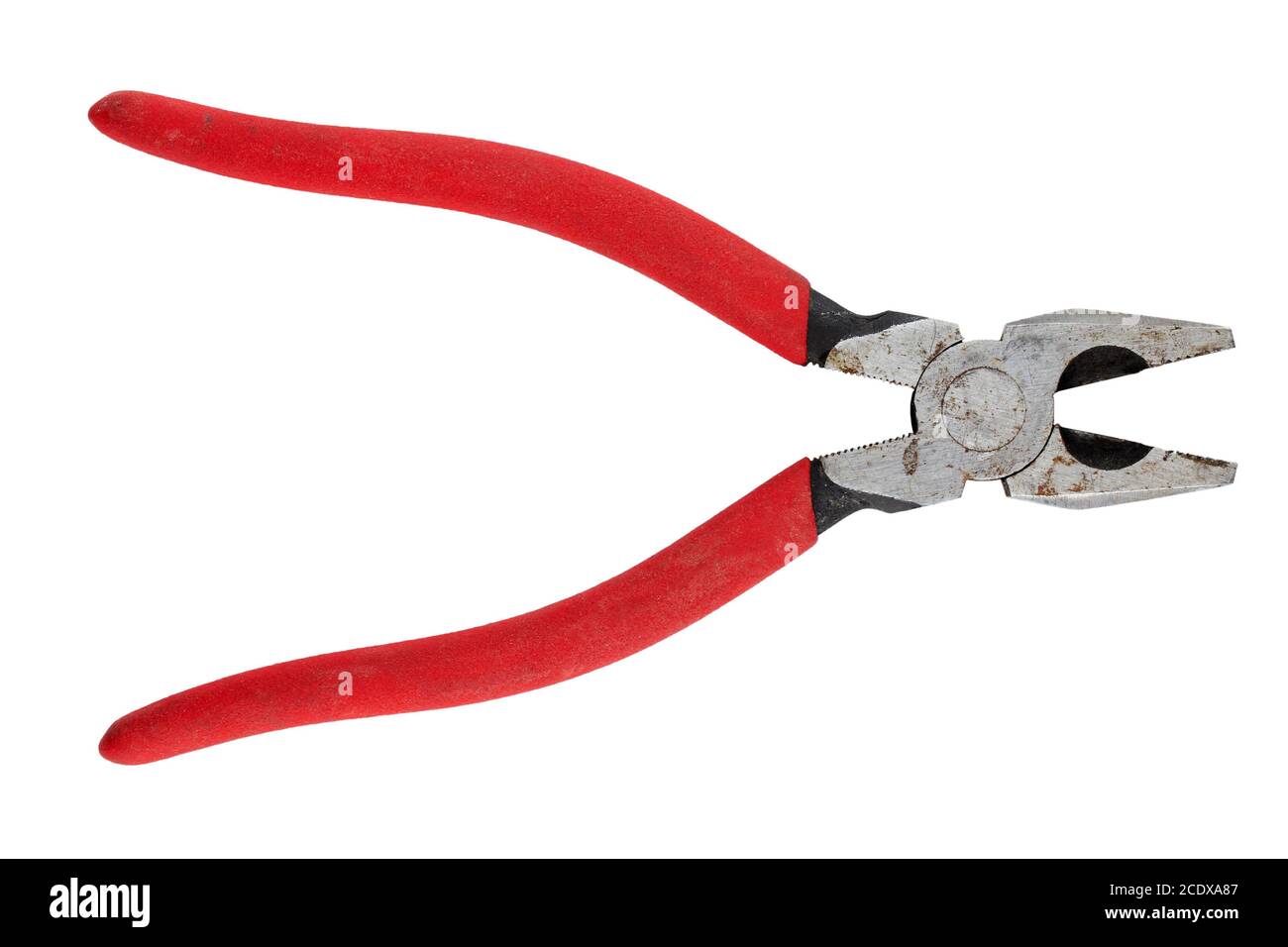 Old pliers with rubber grips in red on a white background. Top view ...