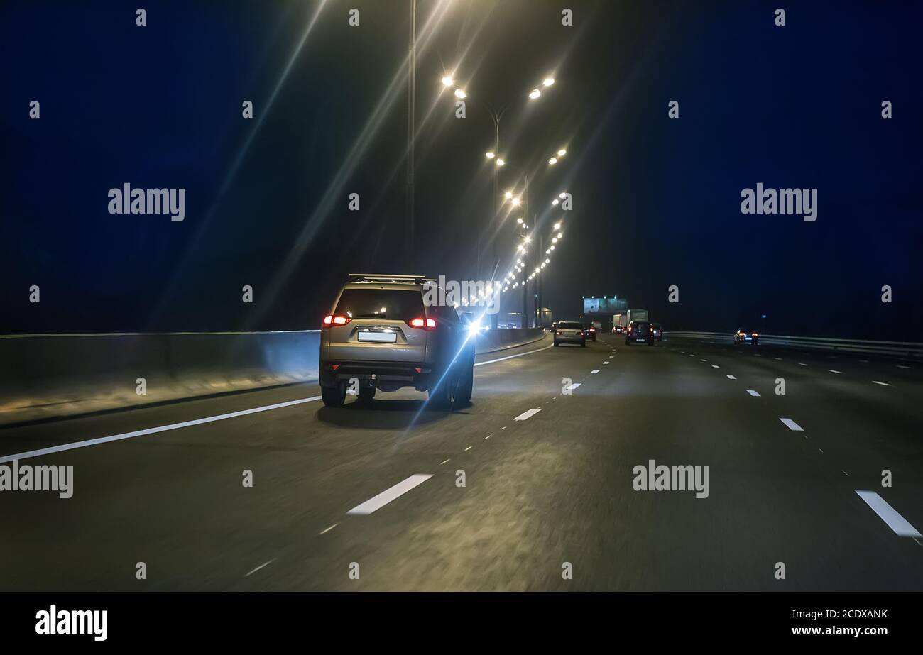 Cars move on the night highway Stock Photo - Alamy