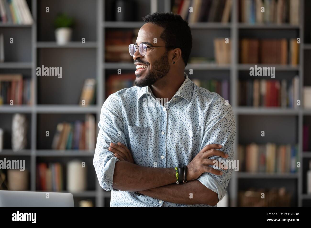 Smiling African American Man Wearing Glasses Dreaming And Visualizing