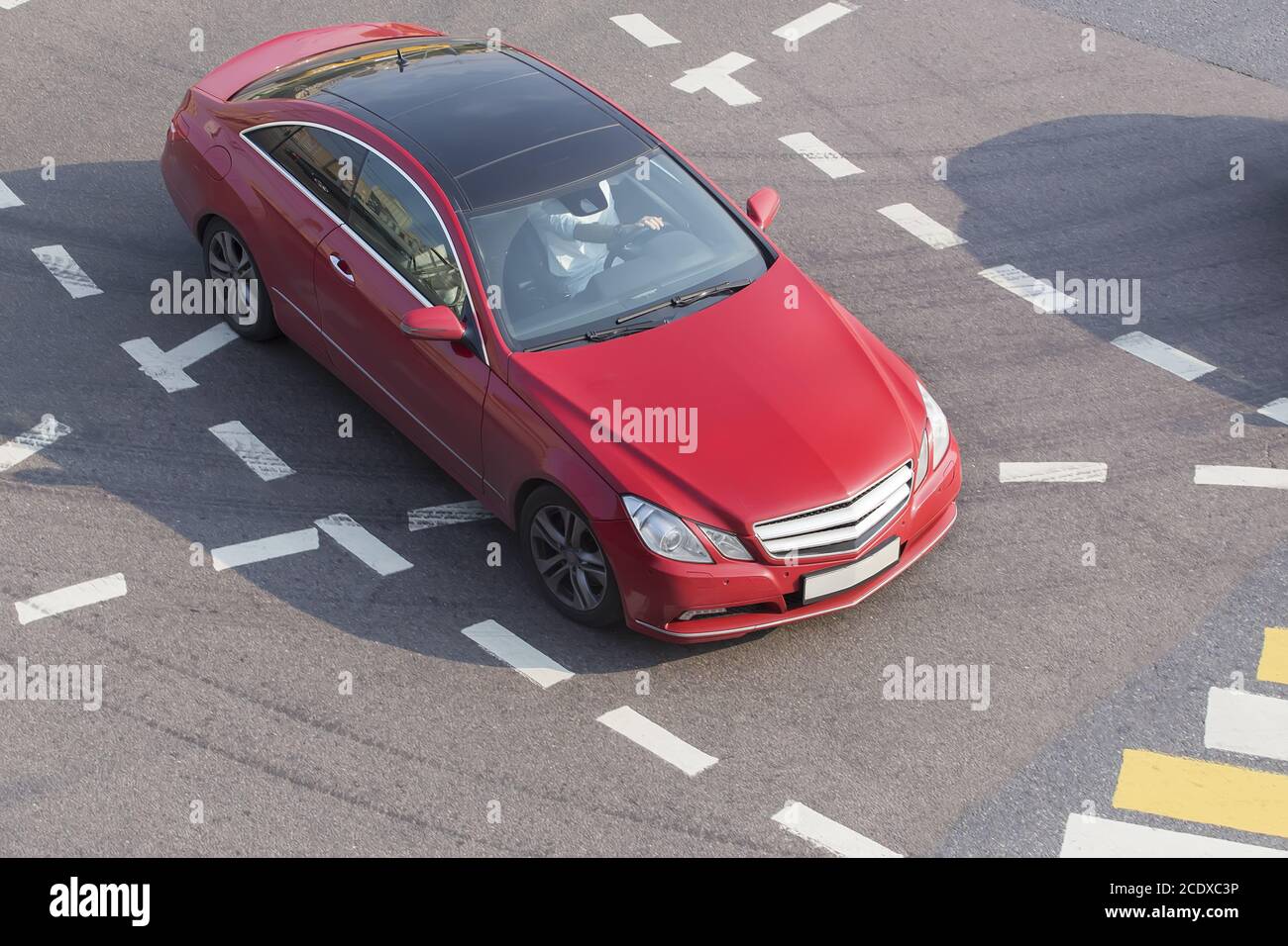 red car at intersection with marking top view Stock Photo - Alamy