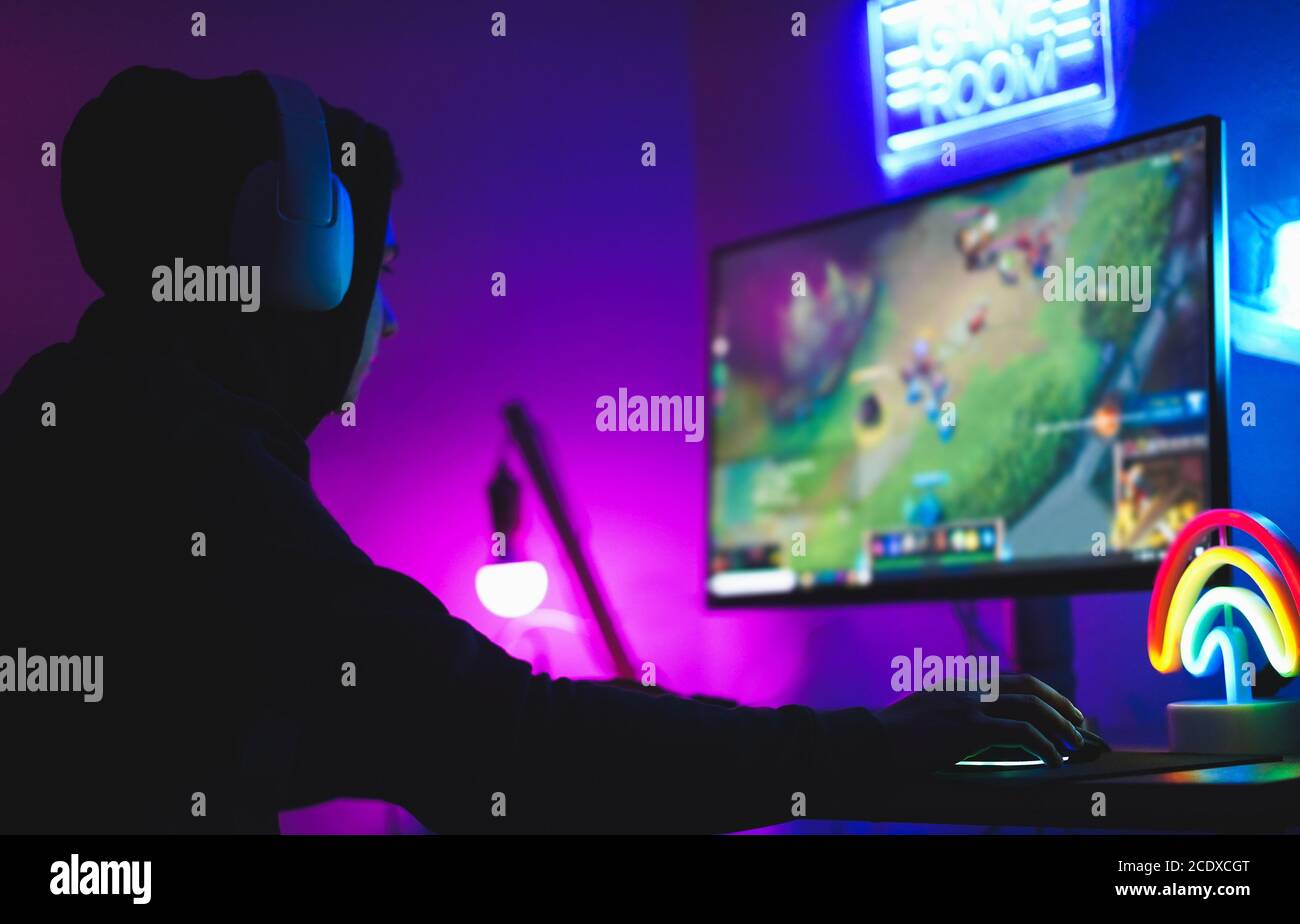 Young streamer gamer playing at strategy game in broadcast browser ...